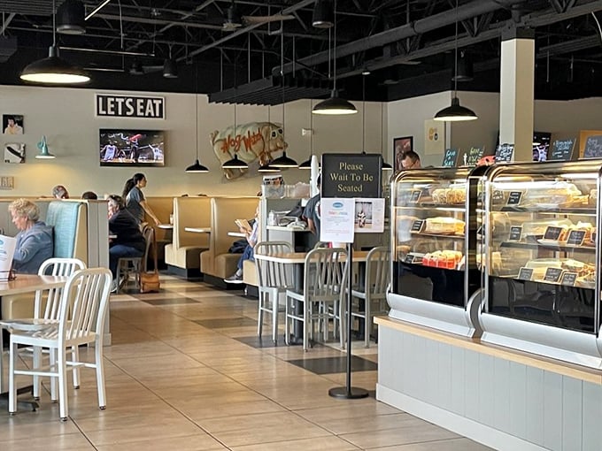 Inside, the "LET'S EAT" sign isn't just decoration—it's the most unnecessary instruction you'll ever receive once those aromas hit you.