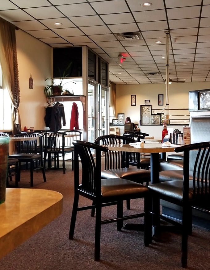 Classic diner ambiance with comfortable booths and practical decor—where conversations flow as freely as the coffee refills.