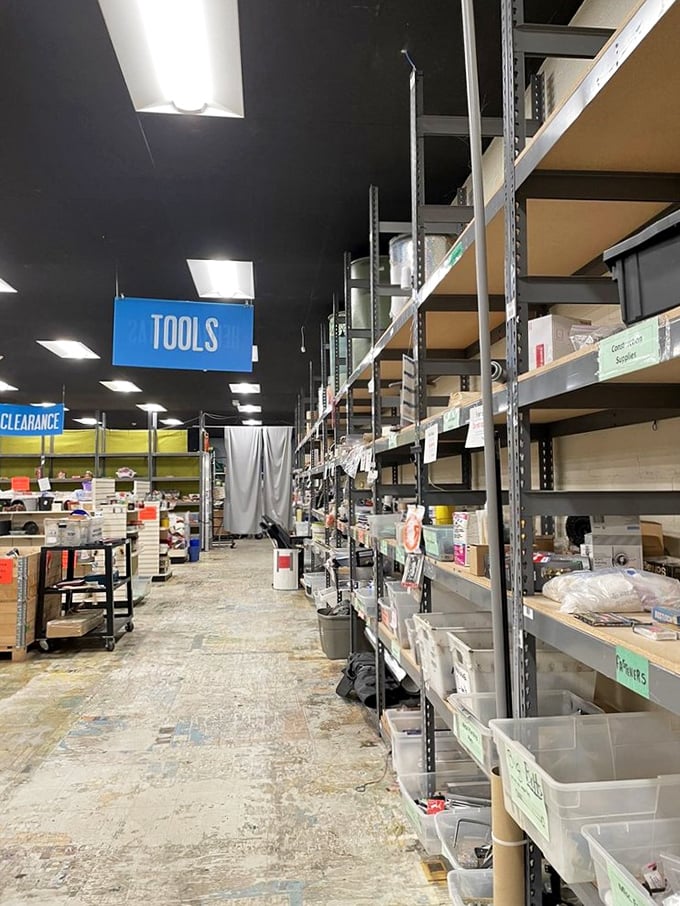 Organized chaos at its finest—shelves upon shelves of potential projects await under signs that guide you through this maker's paradise.