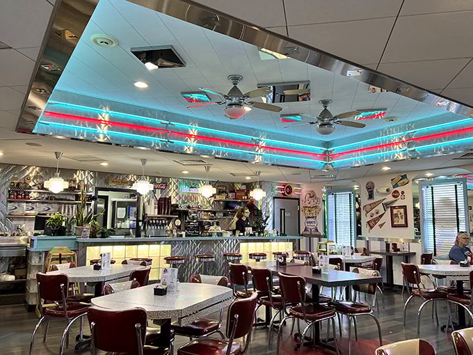 Step inside and the first thing that hits you: those mesmerizing blue and red ceiling lights, creating an atmosphere that would make The Fonz feel right at home.