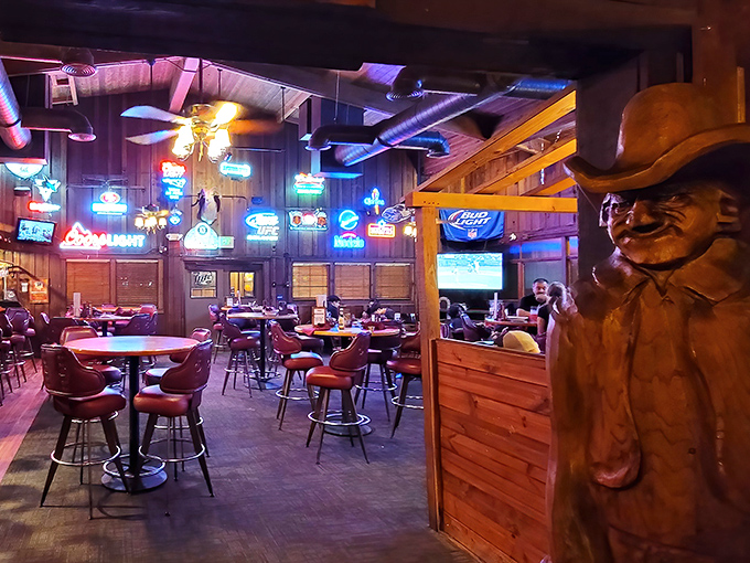 Where Western nostalgia meets serious eating – Cattlemens' bar area proves that neon signs and wooden cowboys make everything taste better.