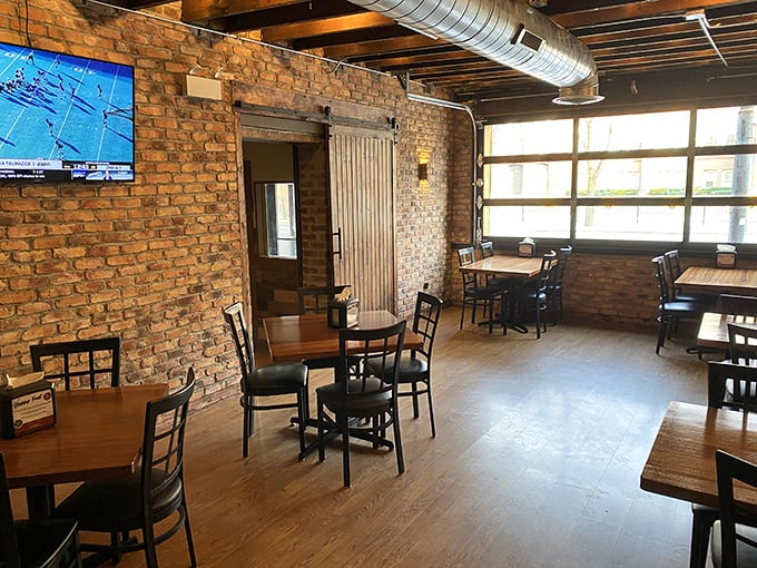 Exposed brick, wooden beams, and that sliding barn door – Offset's interior feels like the coolest friend's loft apartment, if that friend happened to be a barbecue genius.