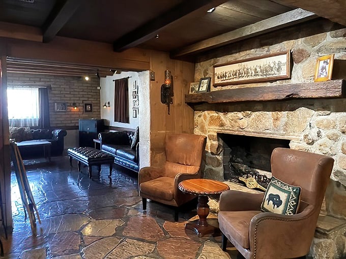 Leather chairs flank a stone fireplace in the waiting area—the Southwest's version of a warm hug before the main event. Cowboy comfort at its finest.