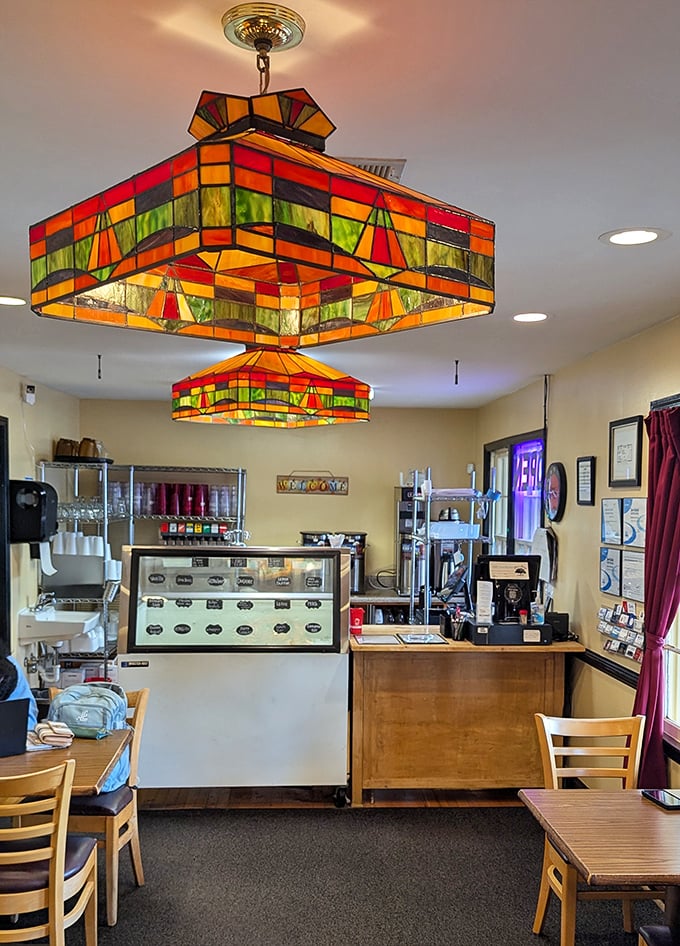 These colorful stained-glass light fixtures aren't just illuminating the room—they're setting the stage for the comfort food theater about to unfold.