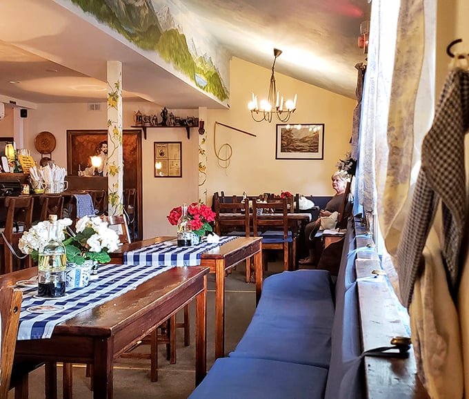 Step inside and you're transported straight to Bavaria—blue checkered tablecloths, warm wood, and decor that whispers "Gemütlichkeit" without shouting "theme restaurant."