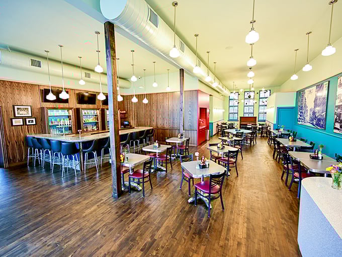 Inside, turquoise walls and pendant lighting create that perfect vintage-modern marriage, where Instagram-worthy design meets genuine historic charm.