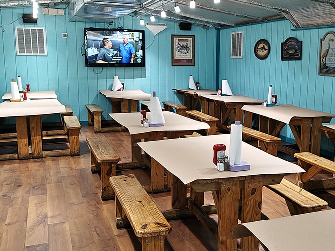 Picnic-style tables with paper coverings telegraph the message: prepare for a deliciously messy affair with your favorite crustaceans.