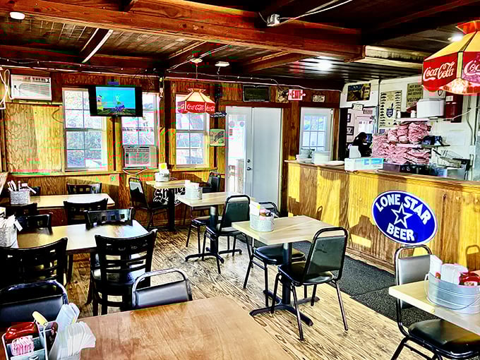 Rustic wooden charm defines the interior, where every table tells stories of burger pilgrimages past. The Lone Star sign isn't just decoration—it's practically a constitutional requirement.