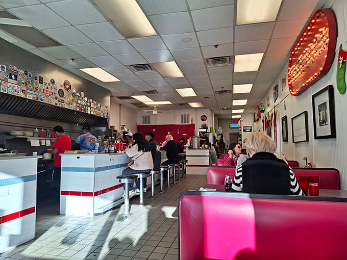 Classic diner magic happens here—red vinyl booths, counter seating, and walls plastered with memorabilia tell you this place takes comfort seriously, not itself. 