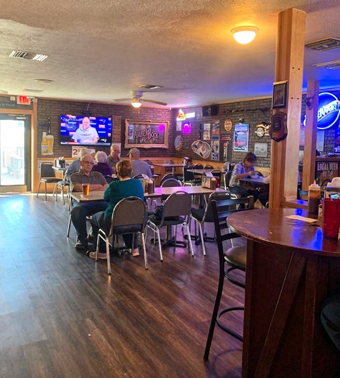 Inside, warm wood tones and brick walls create that perfect "come as you are" atmosphere where napkins aren't just provided—they're mandatory.