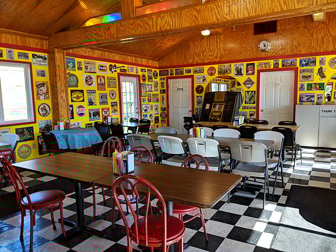 The dining room's yellow walls plastered with memorabilia tell stories that predate Instagram. Each vintage sign a chapter in American food history.