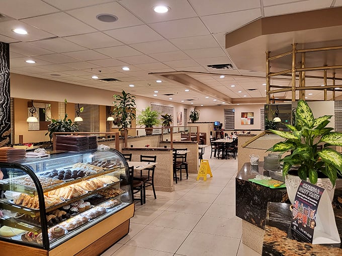 Gleaming display cases filled with tempting pastries greet you upon entry – a sweet hello before you've even reached your table.