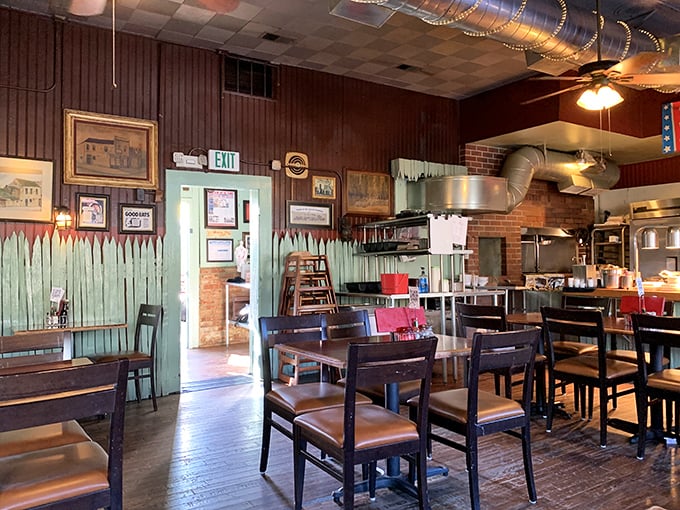 Wood-paneled walls, exposed ductwork, and decades of memories—this dining room feels like your favorite uncle's cabin, if your uncle were a BBQ genius.