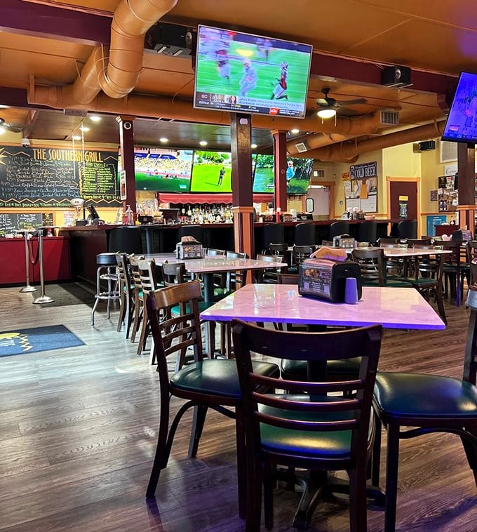 Inside, wooden floors and multiple TVs create that perfect "neighborhood joint" vibe where regulars and newcomers alike feel instantly at home.