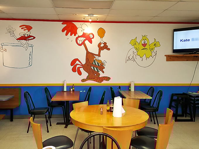 Whimsical cartoon chickens adorn the walls, creating a playful atmosphere that says, "Yes, we're about to eat their relatives, and they're delicious!"