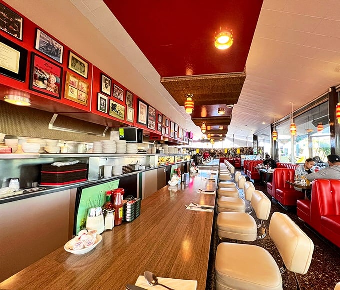 Red vinyl booths and counter seating straight from 1950s California dreams. This isn't just a diner; it's a living museum where breakfast is art.