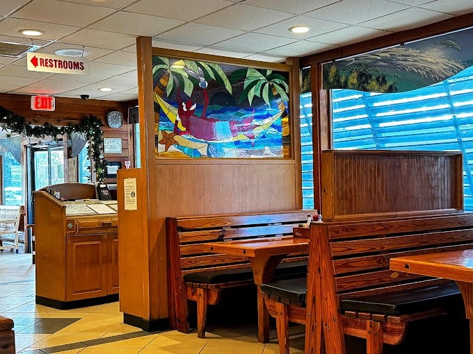 Wooden booths and nautical charm create that classic Florida seafood ambiance. The stained glass artwork reminds you: this isn't your chain restaurant experience.