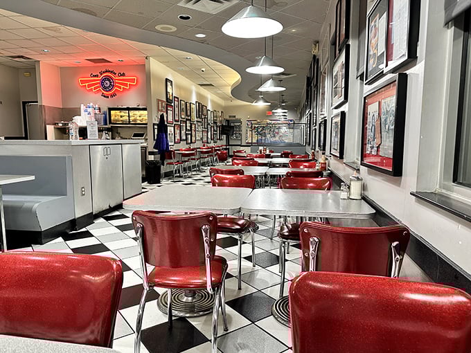 Classic Americana at its finest—red vinyl seats, checkered floors, and walls of history create the perfect backdrop for chili contemplation.