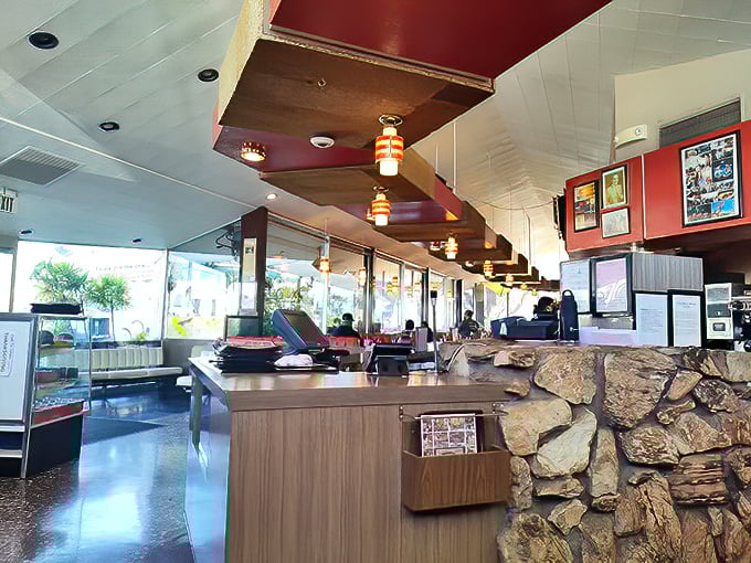 Inside, the stone walls and wood paneling create that perfect time-capsule vibe where calories don't count and coffee refills are endless.