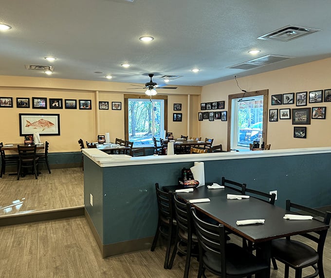 Simple, comfortable dining with walls adorned with fishing photos—visual appetizers before the main event begins.