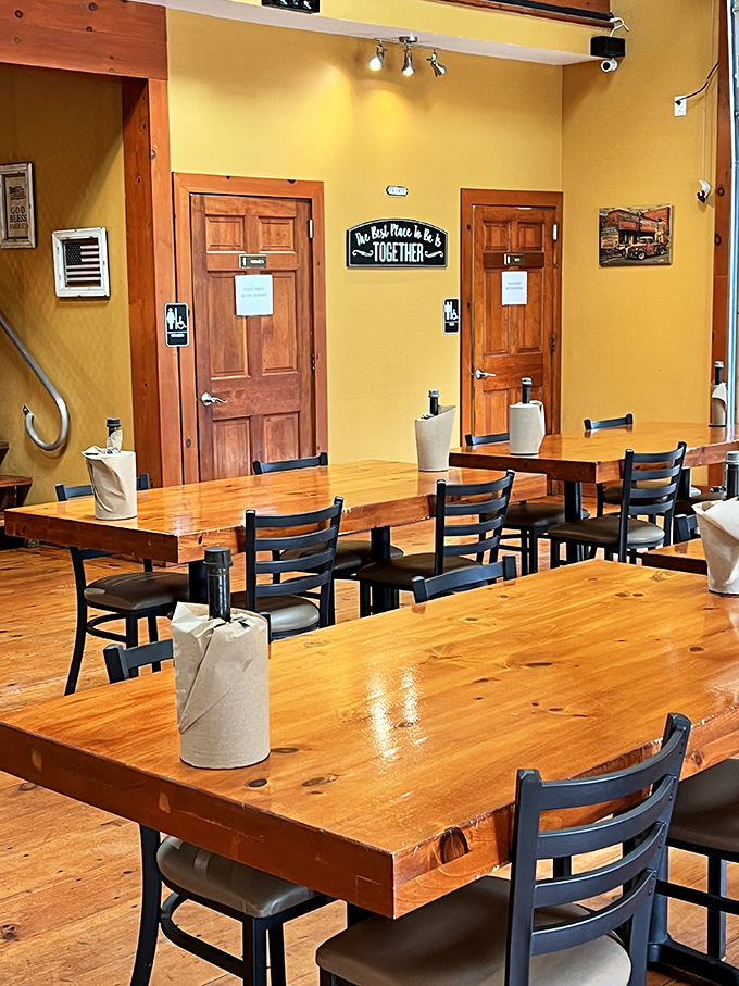 Warm yellow walls, sturdy wooden tables, and a sign reminding us that "The Best Place to Be is Together"—truer words were never hung above a barbecue joint.