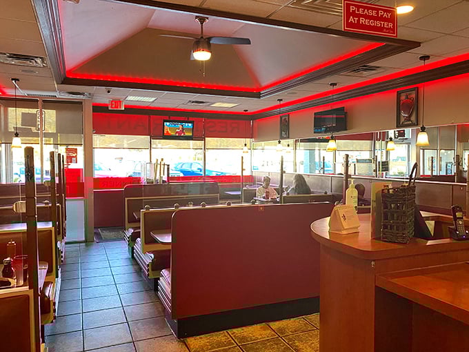 Step inside and the distinctive red accent lighting creates a warm, inviting atmosphere that says "stay awhile, the food's worth it."