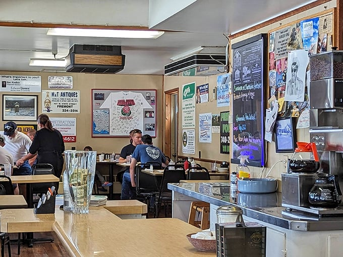 Inside, the walls tell stories through local memorabilia while regulars at the counter participate in the daily ritual of perfect breakfast.