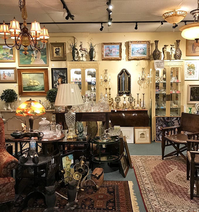 Elegance awaits in this meticulously arranged booth where crystal chandeliers cast dancing light across Persian rugs and gilded frames – Marie Antoinette would approve.