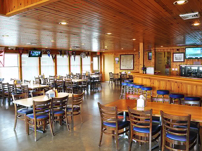 Warm knotty pine paneling wraps around you like a hug from your favorite aunt, creating the perfect backdrop for Lake Erie's finest seafood feast.