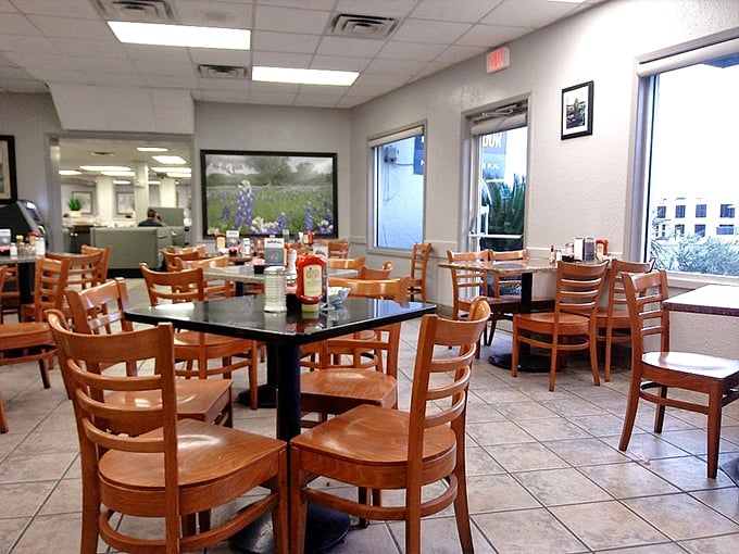 Simple wooden chairs, clean tile floors, and bright lighting—this no-frills dining room lets the food be the star.