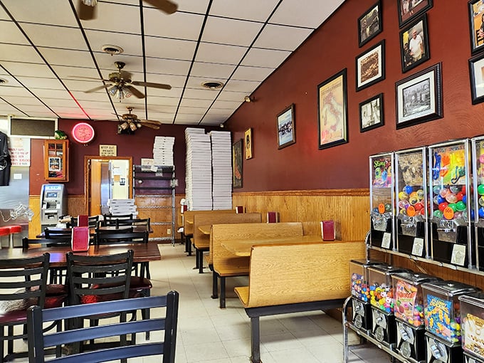 Inside Fiori's, time stands deliciously still. Wood paneling, burgundy walls, and candy machines create that perfect "your neighborhood pizzeria since forever" vibe.