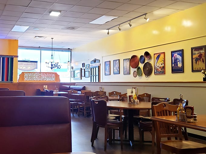 Sunshine-yellow walls adorned with colorful plates and vintage posters create the perfect backdrop for conversations that flow as easily as the coffee refills.
