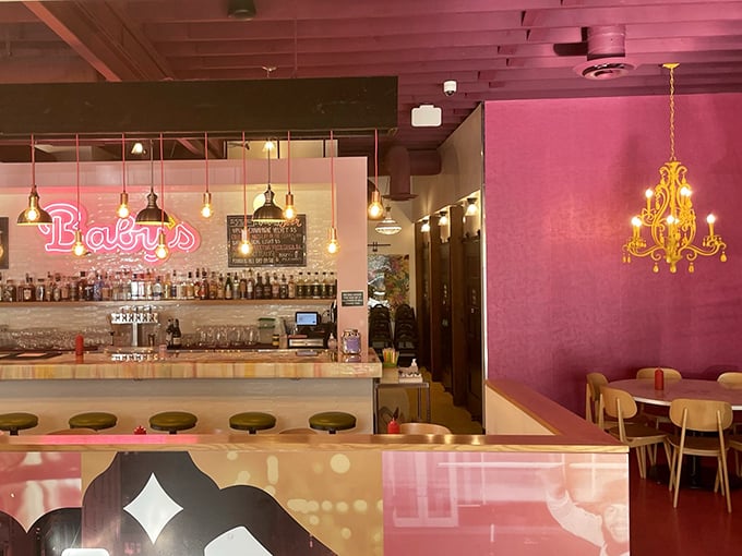 Pink walls, gold accents, and that chandelier – Baby's interior feels like your coolest friend's apartment, if that friend also made killer milkshakes.