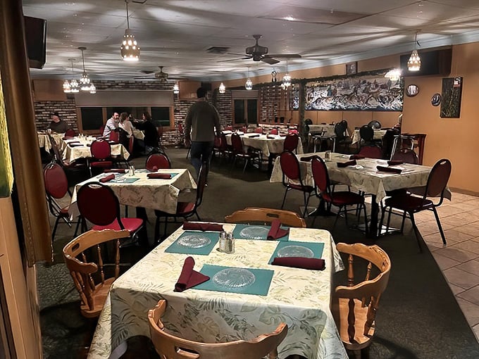 Inside Dreamland, tables draped in patterned cloths and comfortable red chairs create that perfect "special yet familiar" atmosphere that defines the Wisconsin supper club experience.