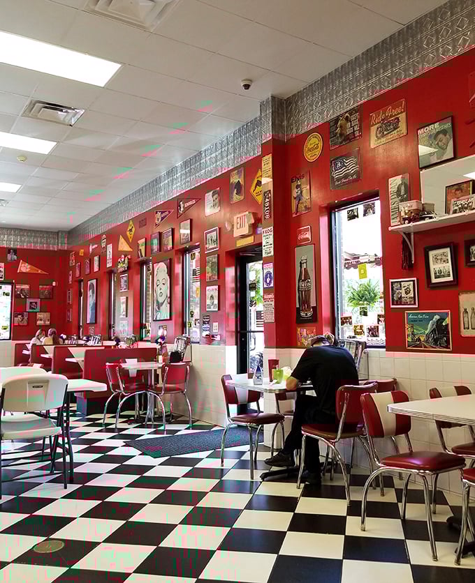 Red walls adorned with Americana memorabilia create the perfect backdrop for comfort food conversations. This isn't decoration—it's a time machine.