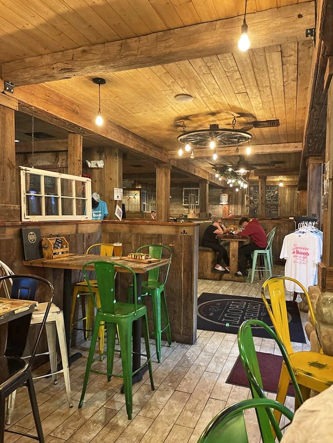Wooden beams, colorful metal chairs, and that wagon wheel chandelier – this isn't your typical seafood joint, it's Indiana's rustic answer to coastal dining.