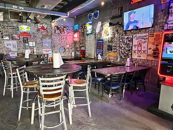 Dollar bills wallpaper and neon signs illuminate this former ice house, where simplicity reigns and pretension goes to die.