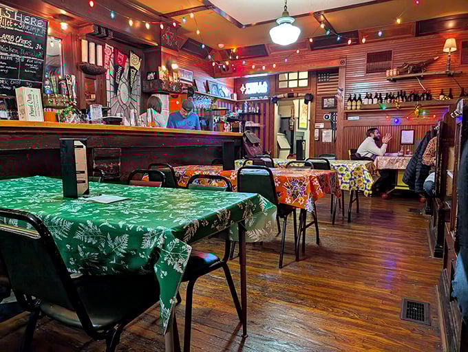 Colorful tablecloths and year-round Christmas lights create the kind of warm, unpretentious atmosphere where memorable meals and conversations naturally unfold.