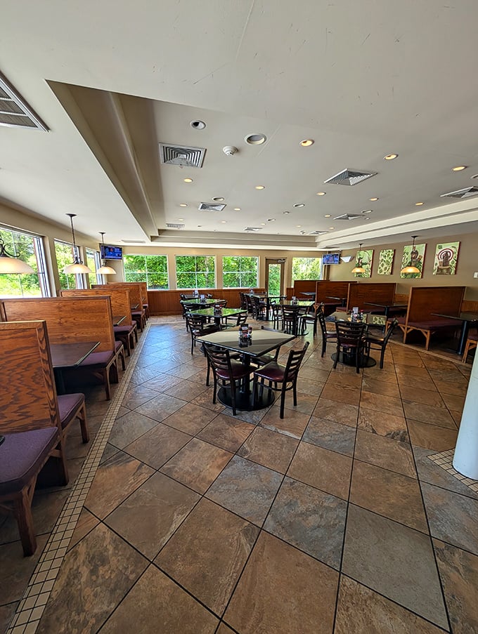Sunlight streams through large windows, illuminating wooden booths and tile floors—the perfect setting for plotting your next meal conquest.