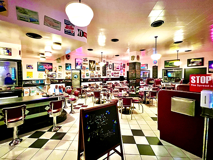 Step inside and the nostalgia hits harder than your grandmother's hug – checkered floors, red vinyl booths, and walls plastered with memories of simpler times.