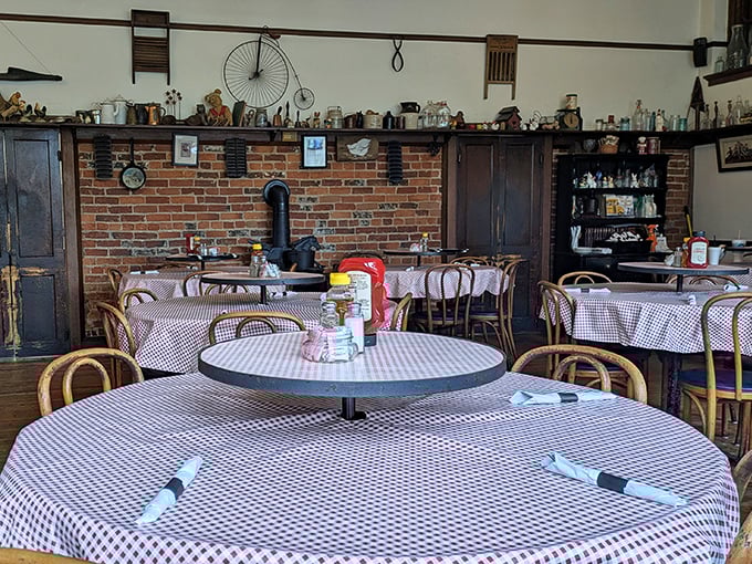 Classic checkered tablecloths and vintage treasures lining the walls—this isn't just decoration, it's a master class in nostalgic dining atmosphere.