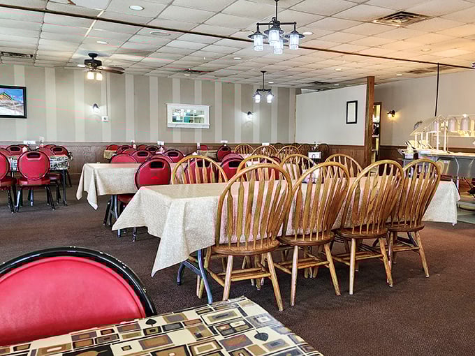 Think grandma’s Sunday spread meets small-town buffet charm — warm wood chairs, soft lights, and tables ready for conversation.