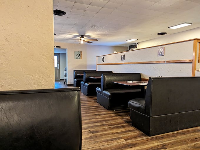 Classic black vinyl booths await your stories, your laughter, and your appreciation for a place where comfort trumps trendiness every time.