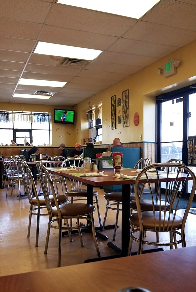 Yellow walls, chrome chairs, and a game on TV – the diner's interior offers that perfect "everybody knows your order" community vibe.