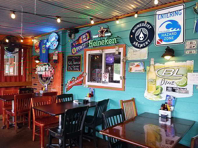 Turquoise walls adorned with beer signs and a "Tsunami Hazard Zone" warning – because nothing says authentic seafood like coastal-themed irony 500 miles from the ocean.