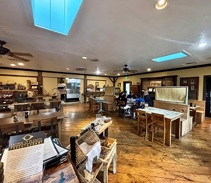 Wide-plank floors and blue skylights create a space that's both rustic and refined—like dining in a Pinterest board that serves incredible food.