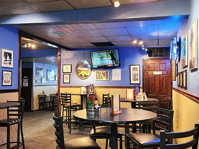 Blue walls and yellow wainscoting create a cozy atmosphere that feels like the living room of your coolest friend—if that friend made incredible burgers.