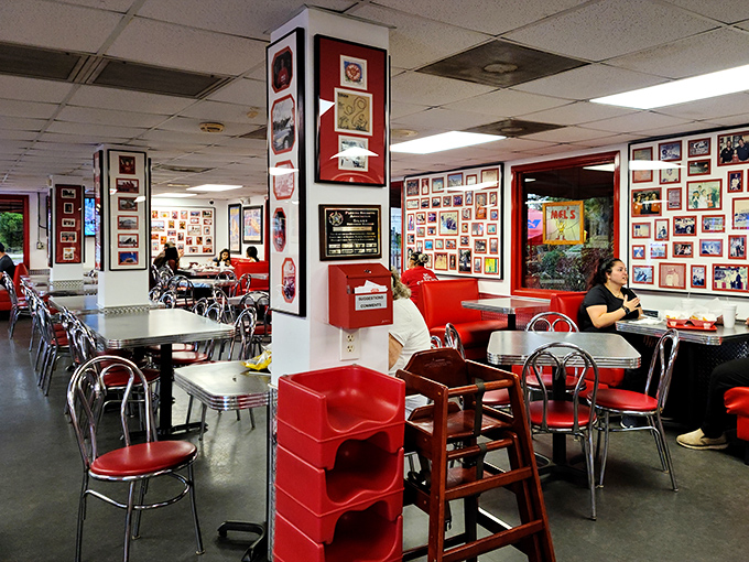 Step inside and you're greeted by a museum of memories – walls plastered with photos that tell the story of Tampa's love affair with the perfect hot dog.