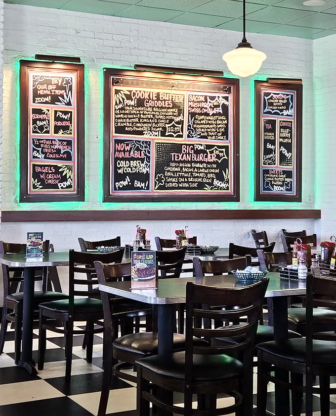 Chalkboard menus announce daily specials with artistic flair, while the classic checkerboard floor says, "Yes, you've found diner nirvana."