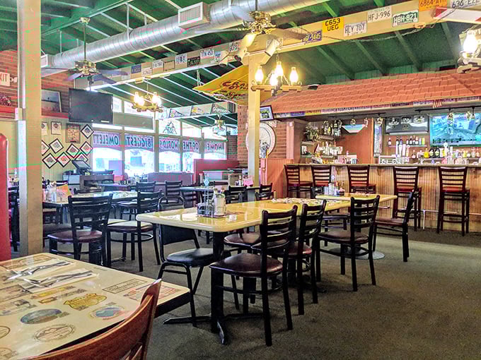 Green ceiling, license plates, and honest-to-goodness comfort—this isn't interior design, it's a time machine to when diners ruled American cuisine.